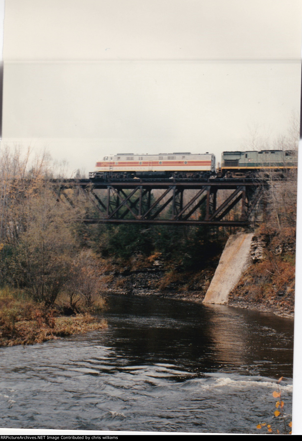DLW 808 heads south over Sugar River bridge in upstate NY